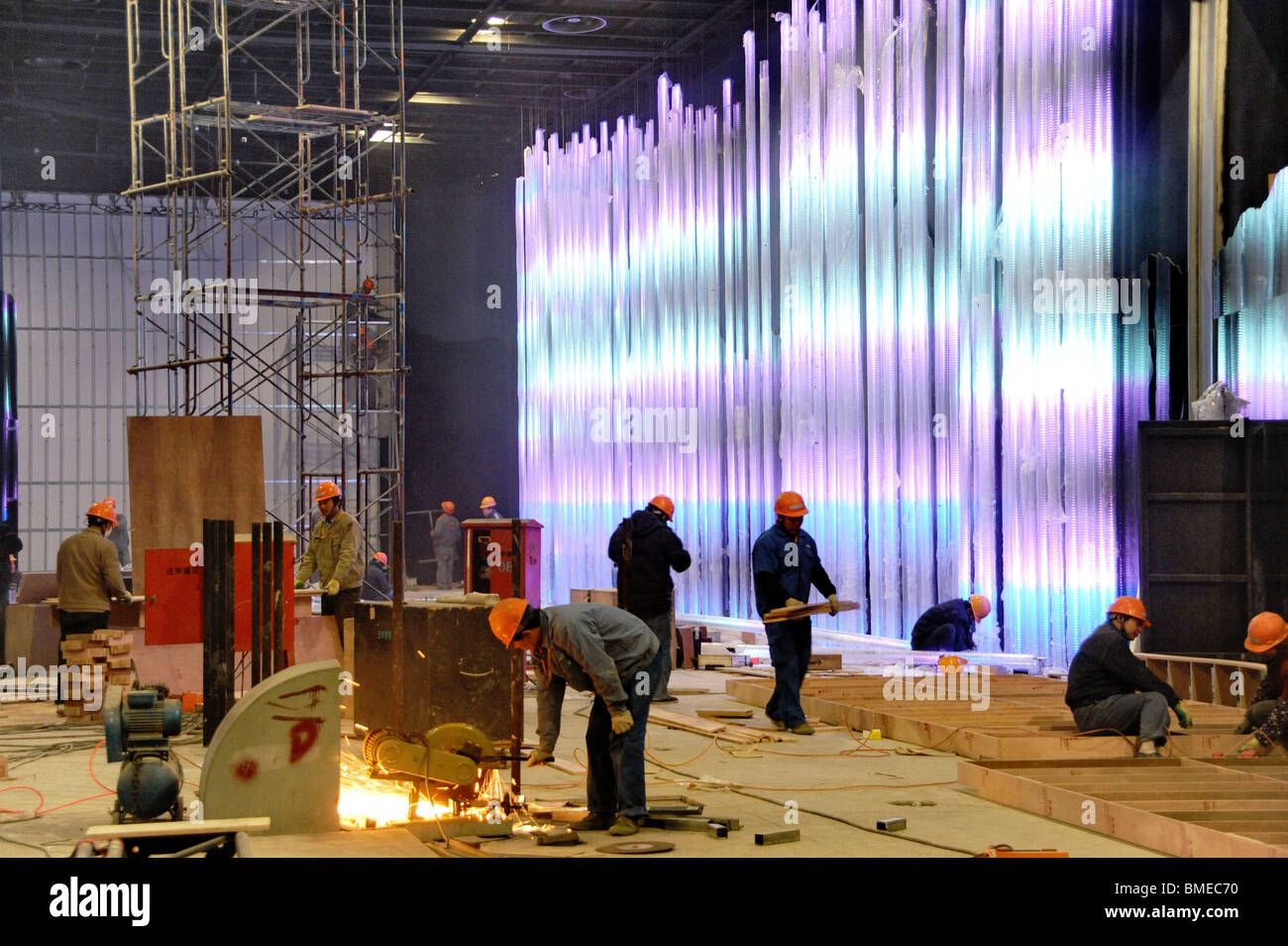 Construction workers rennovating an exhibition hall, 2010 Shanghai ...