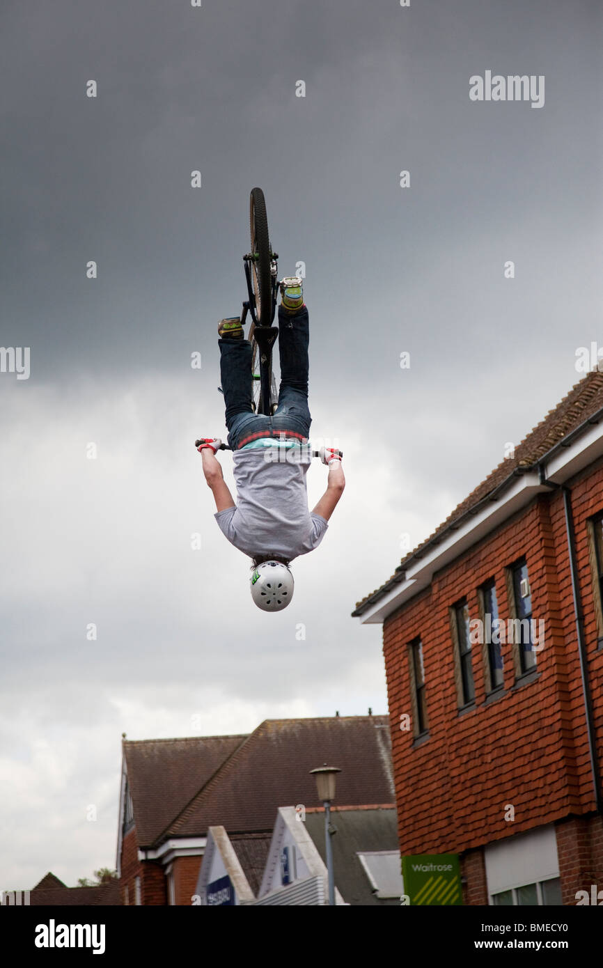 A BMX rider performs a somersault during an acrobatic display Stock ...