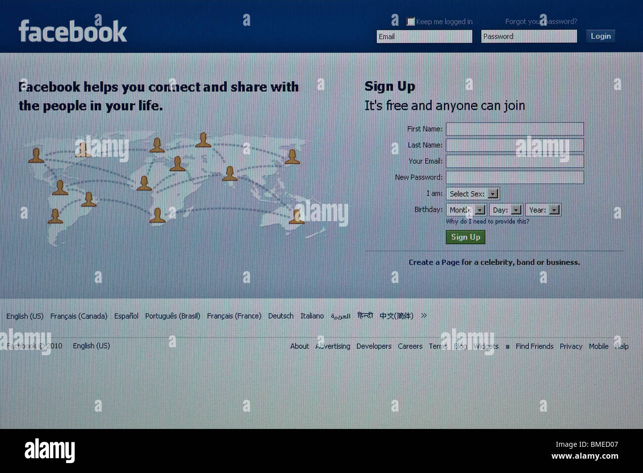facebook through a computer wide screen monitor Stock Photo - Alamy