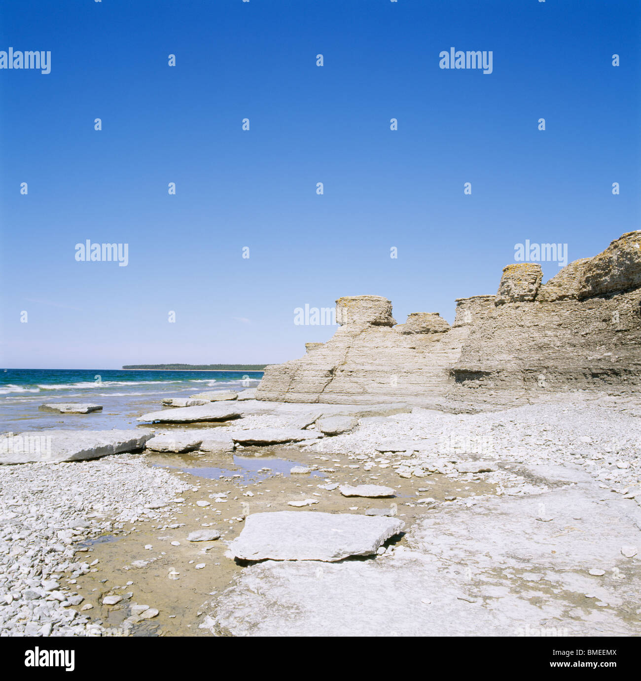 View of limestone pillar on beach Stock Photo - Alamy