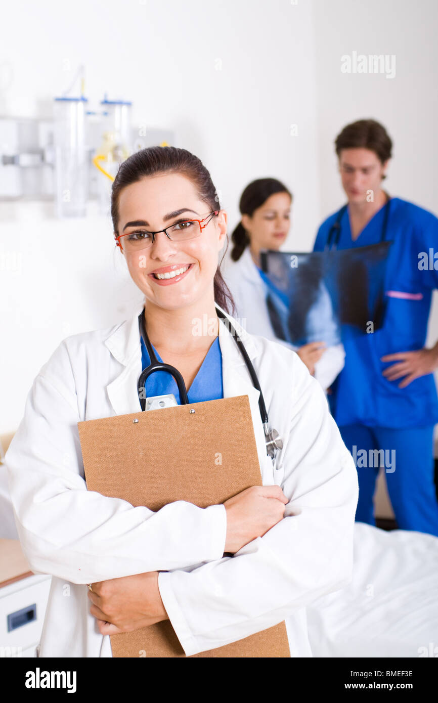 beautiful young health care workers in hospital, background is her ...