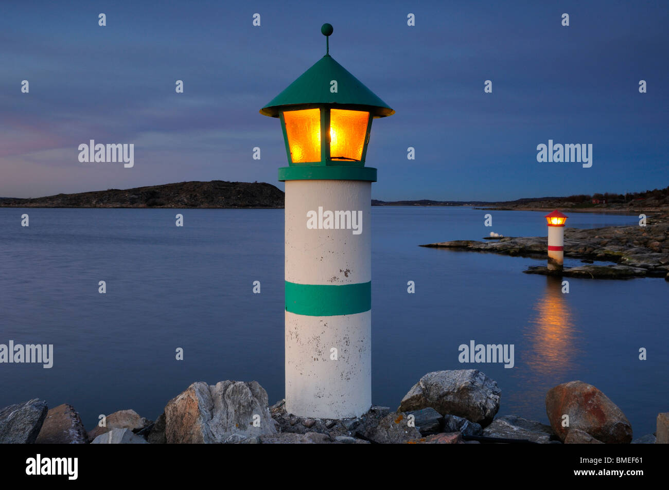 Scandinavia, Sweden, Vastkusten, View of illuminated lighthouse on sea ...