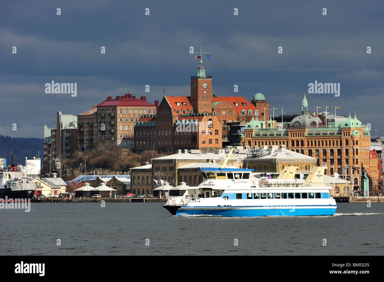Scandinavia, Sweden, Gothenburg, View of ship on sea with cityscape in ...