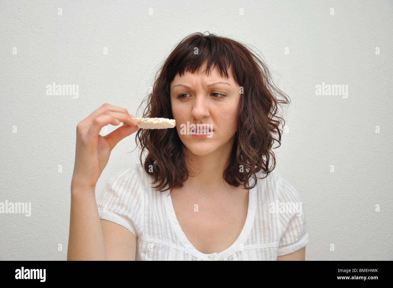Woman eating rice cake hi-res stock photography and images - Alamy