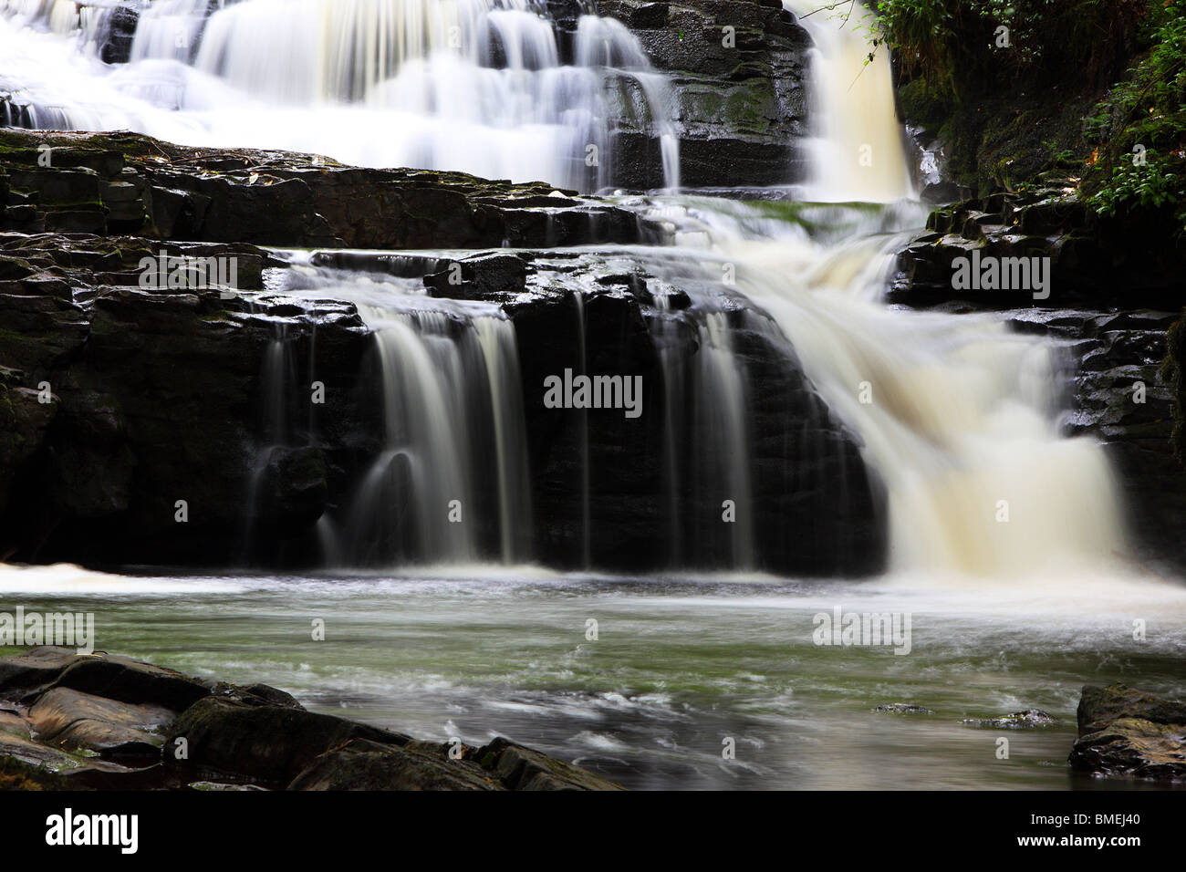 A waterfall on the River Mulcaire in the Clare Glens Nature Park near ...
