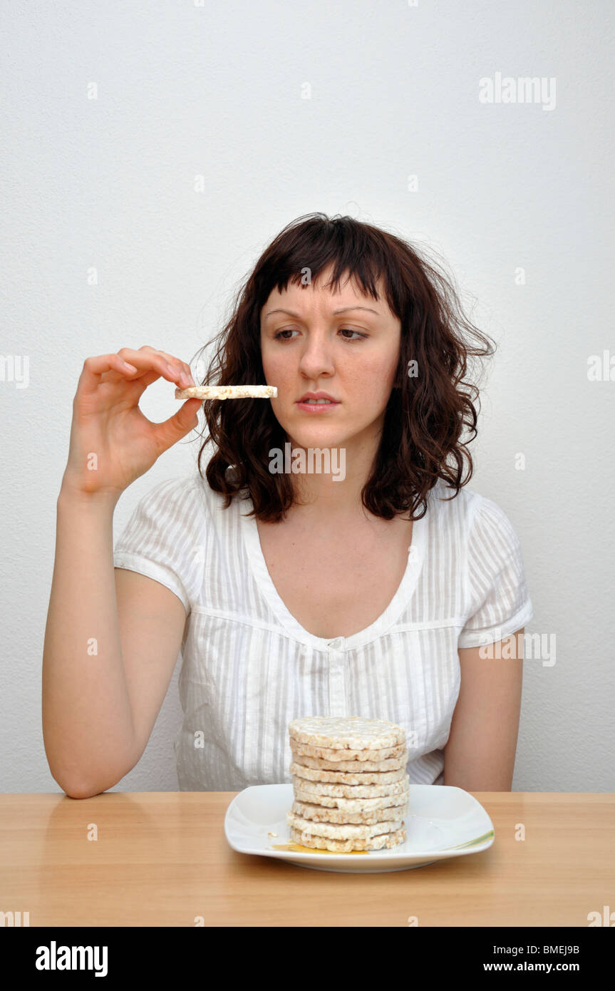 Woman eating rice cake hi-res stock photography and images - Alamy