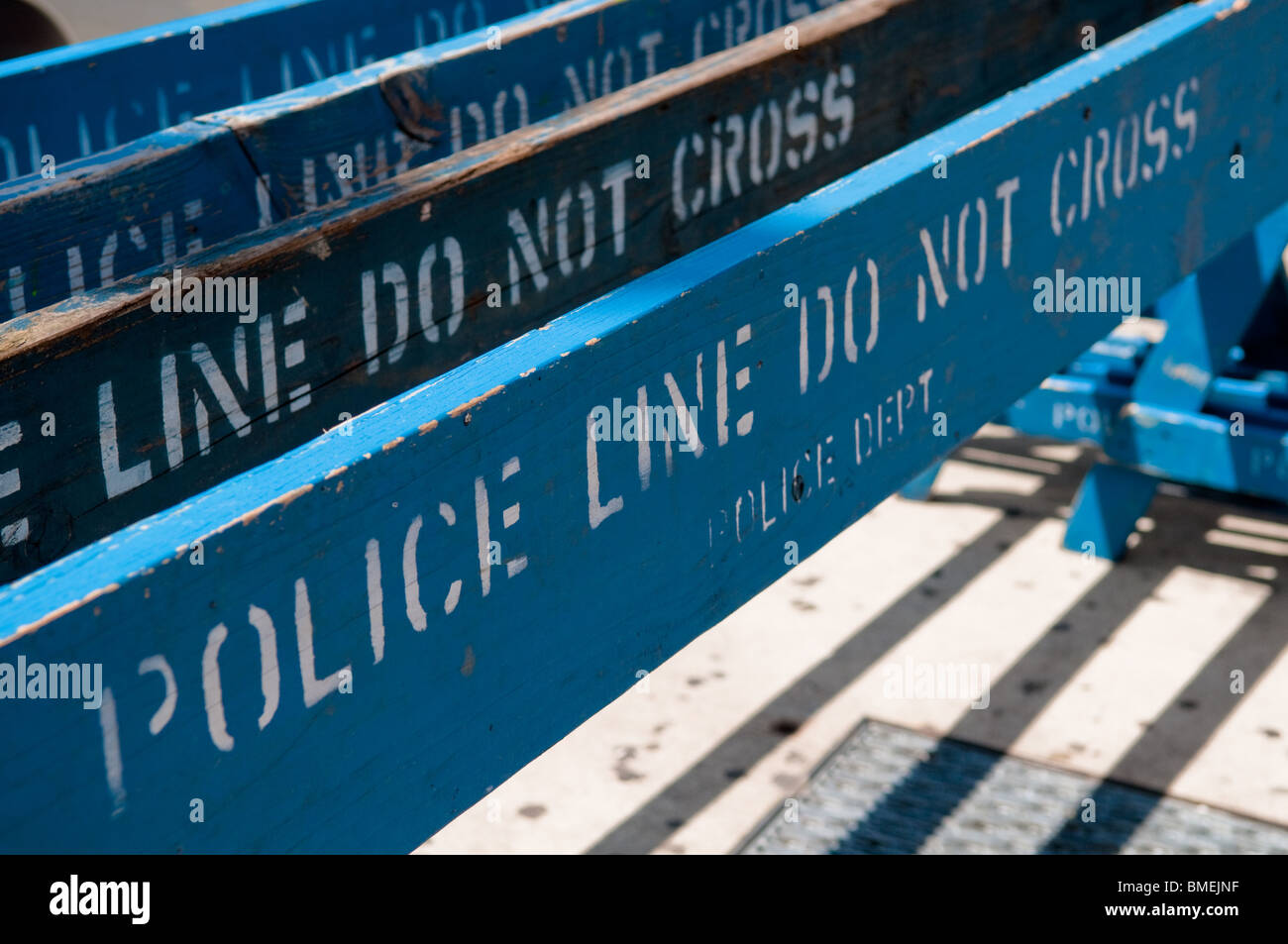 Rows of painted blue police department barriers used for public safety ...