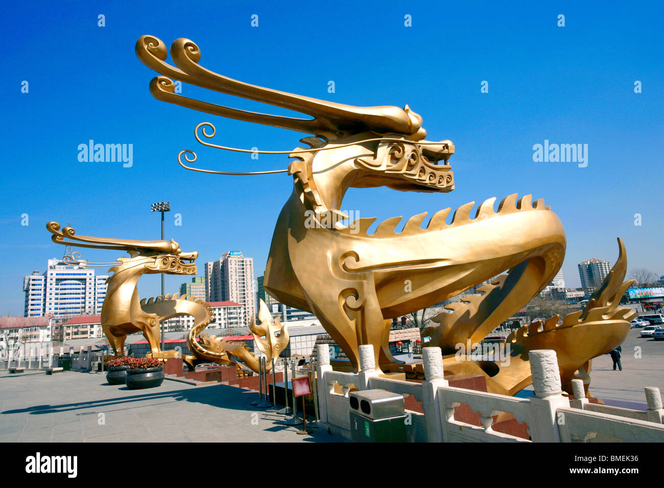 Golden dragon statues in front of Beijing Central Television Tower ...