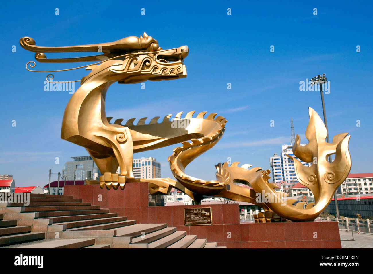 Golden dragon statue in front of Beijing Central Television Tower ...