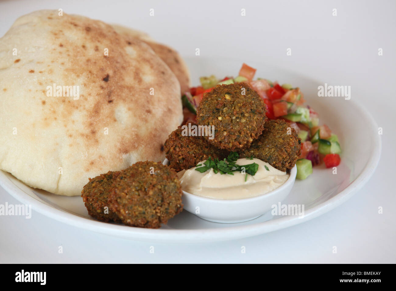 A plate falafel balls (deep fried ground chickpea) Tahini salad and ...