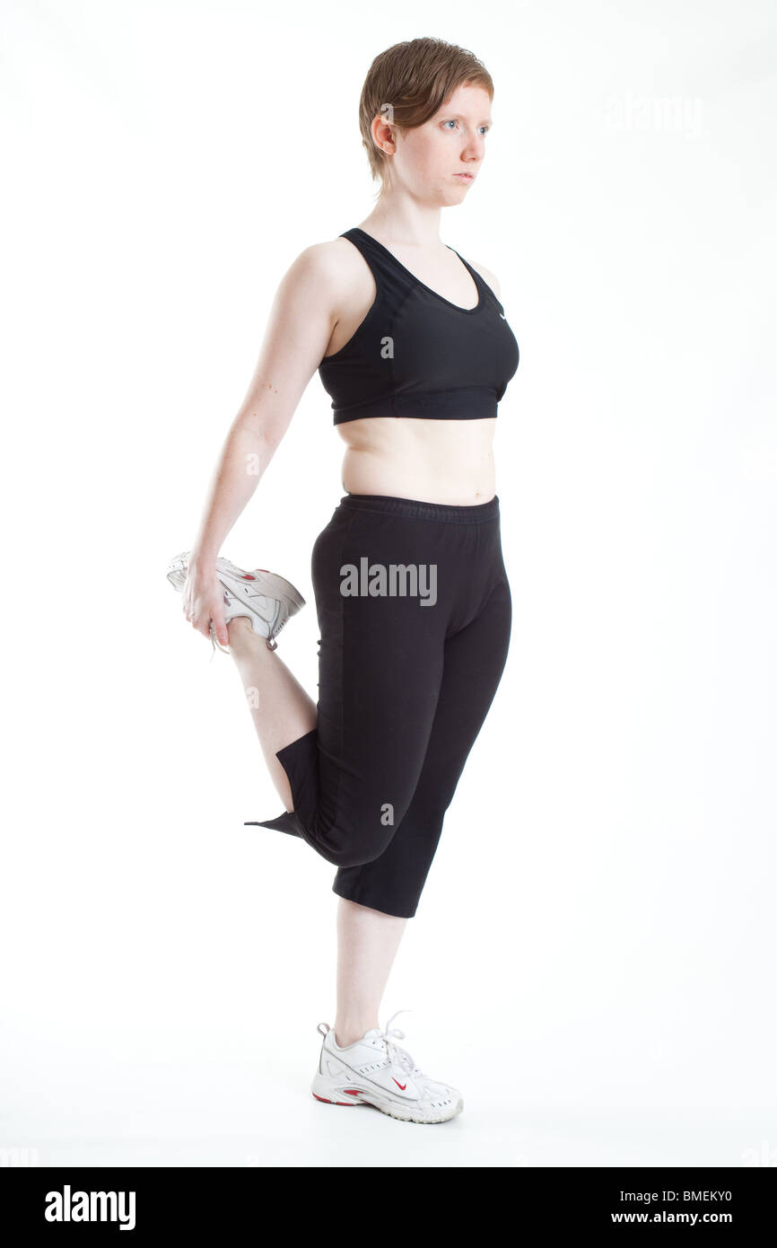 A young woman exercises on a white background Stock Photo - Alamy