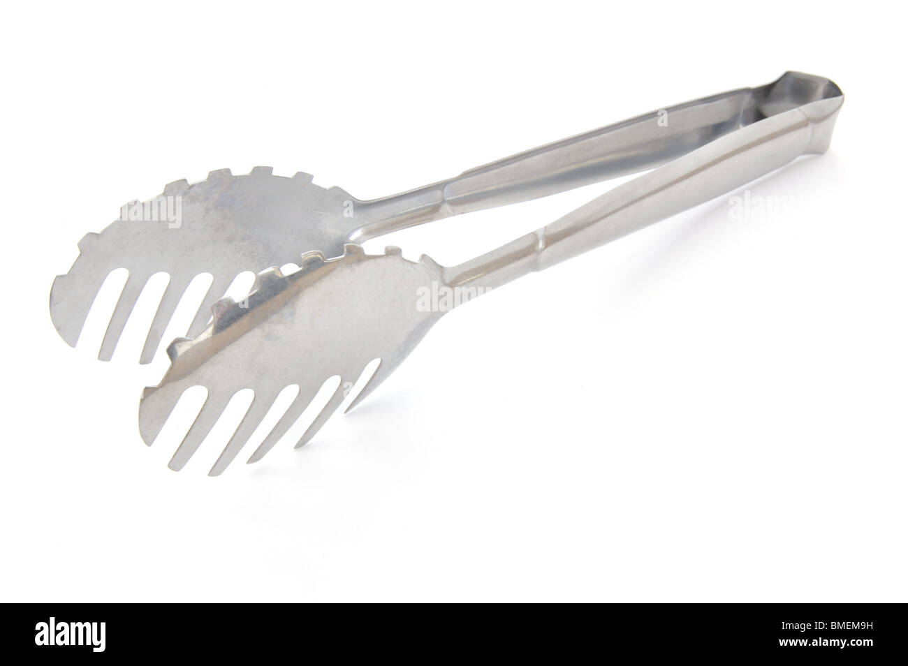 Stainless steel cooking tongs isolated on a white background Stock ...
