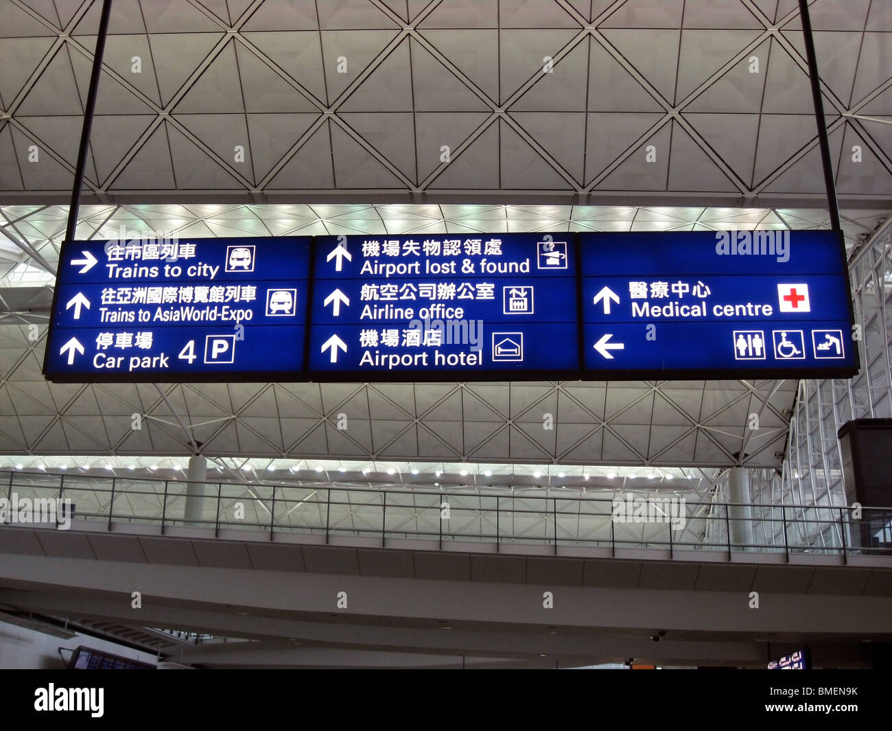 Chinese and English directional signs in Hong Kong airport Stock Photo ...