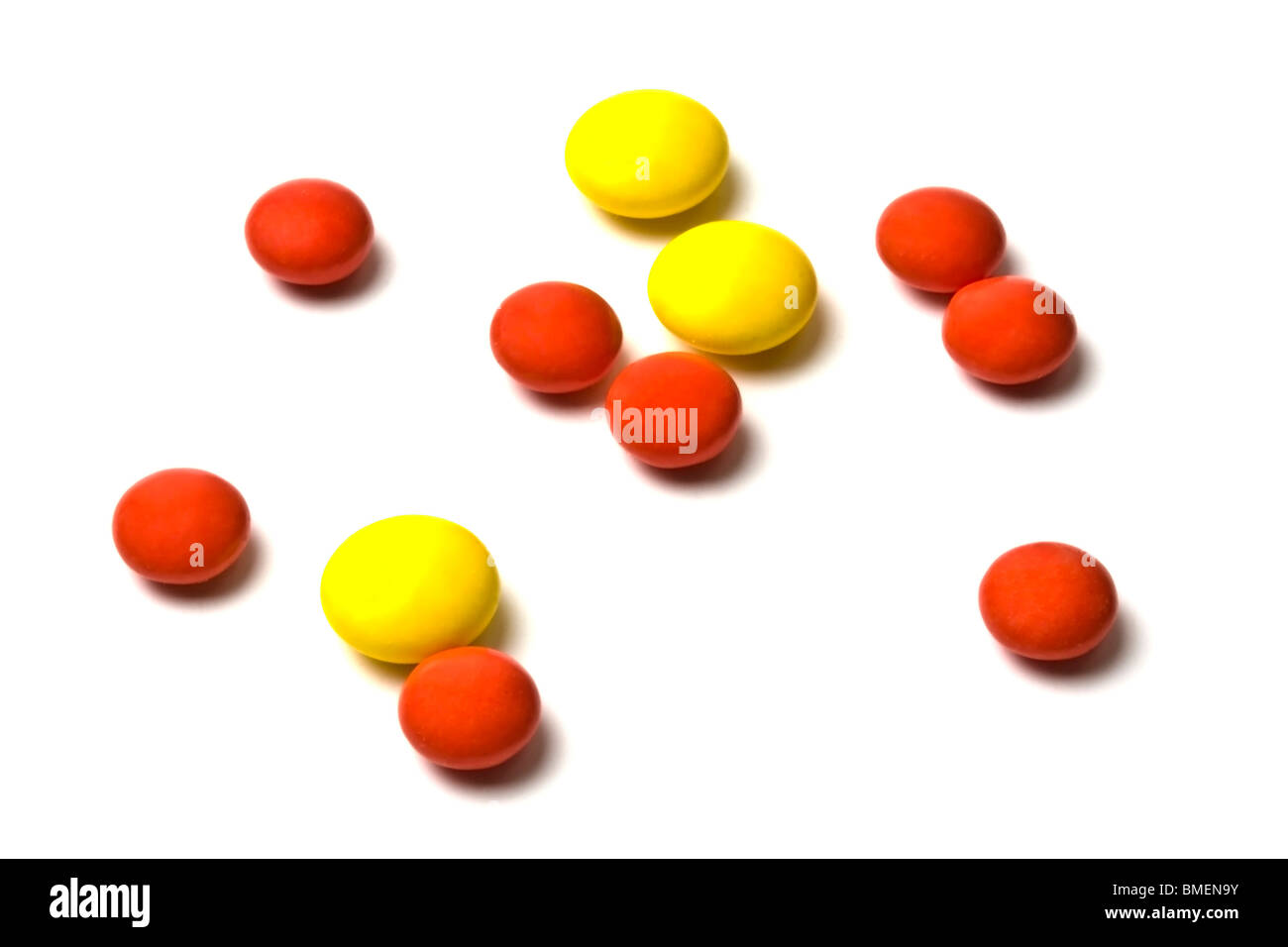 Red and yellow pills isolated on white background Stock Photo - Alamy