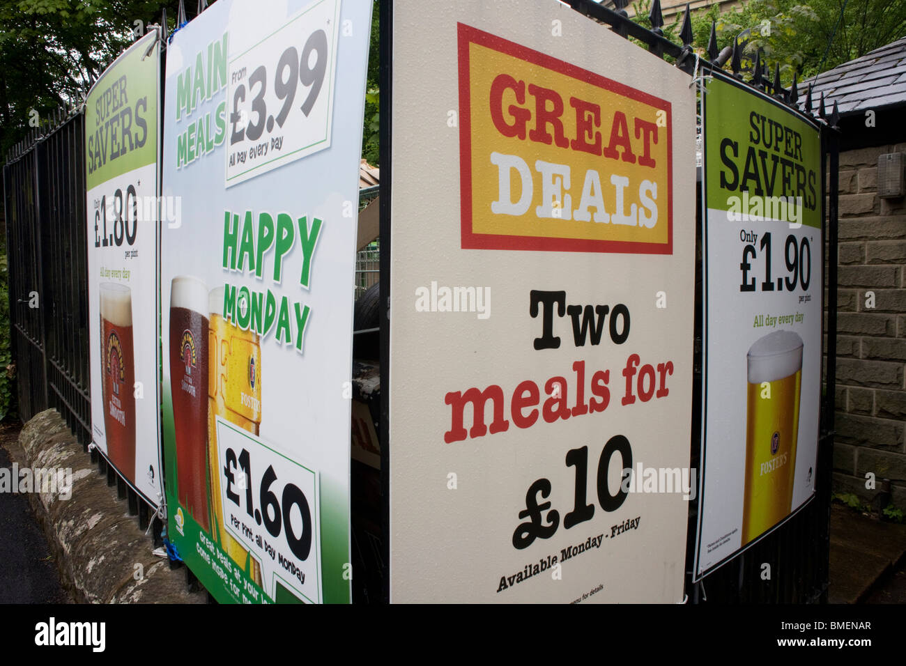 Happy Hour drinks sign offers outside a Buxton pub Stock Photo - Alamy