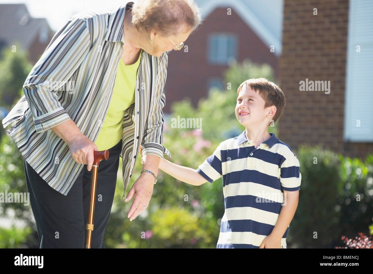 Boy helping elderly woman in hi-res stock photography and images - Alamy