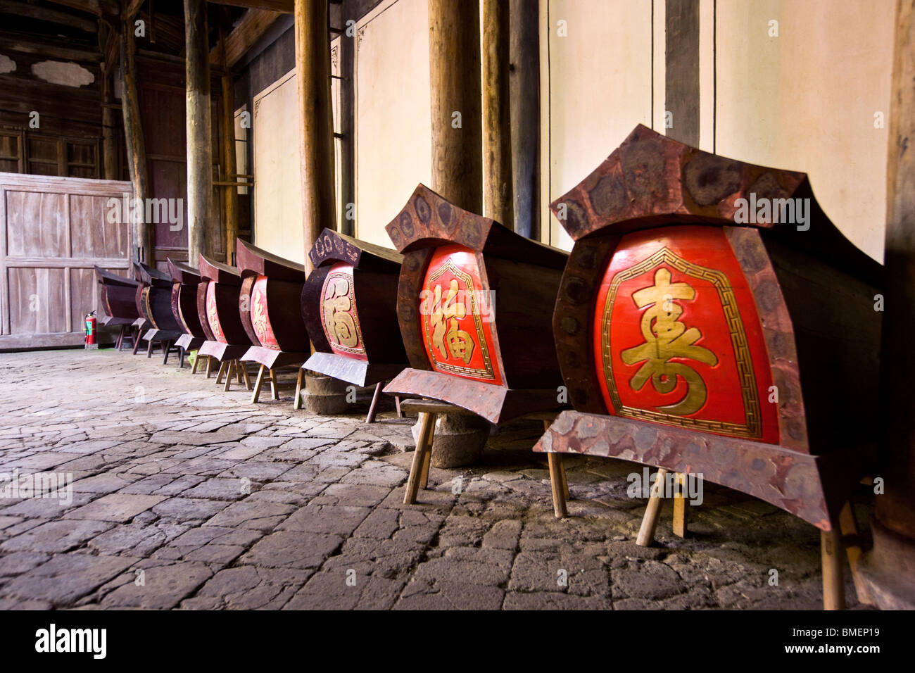 A row of wooden coffins in Ancestral Hall Of He Family, Guodong Ancient ...