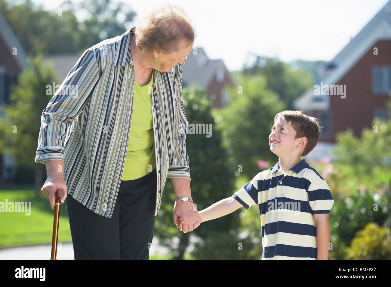 Boy helping elderly woman in hi-res stock photography and images - Alamy