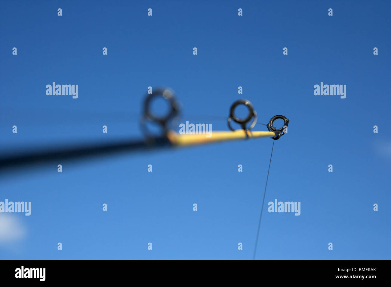 rod and line fishing against blue sky Stock Photo - Alamy