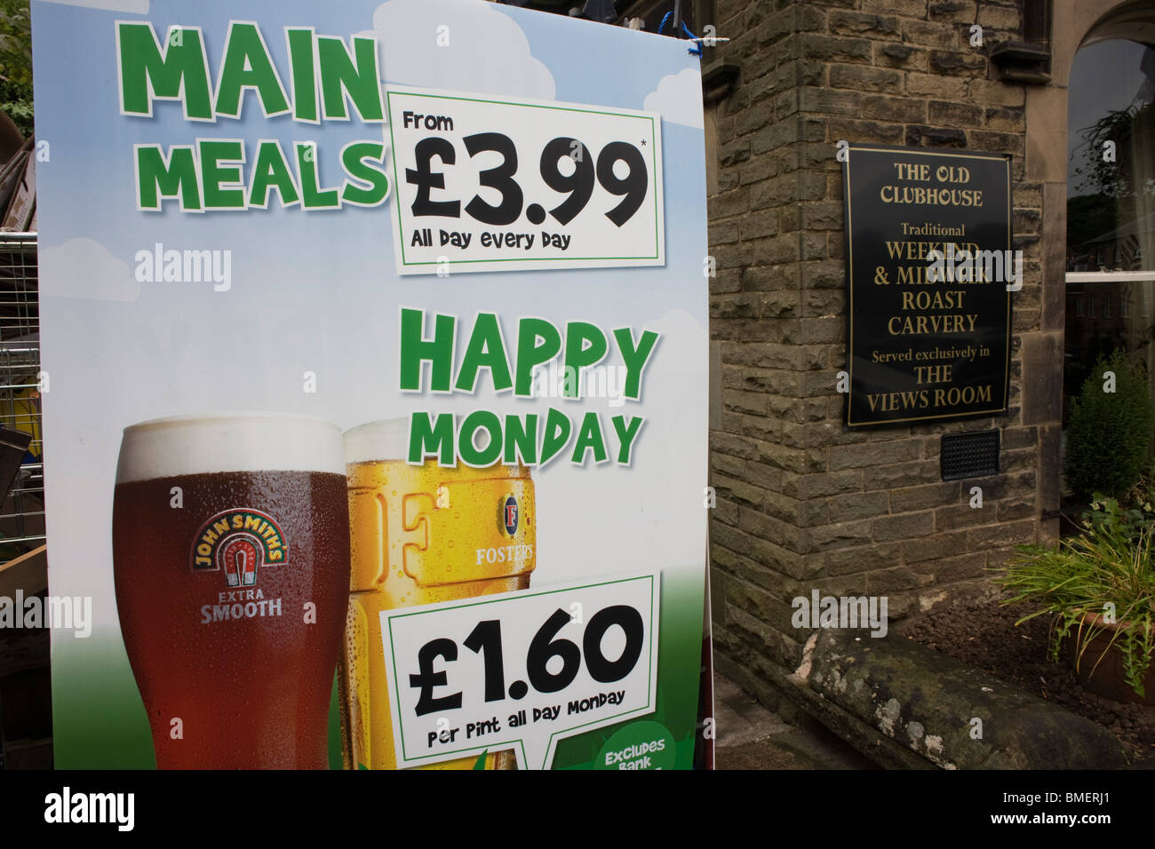 Happy Hour drinks sign offers outside a Buxton pub Stock Photo - Alamy