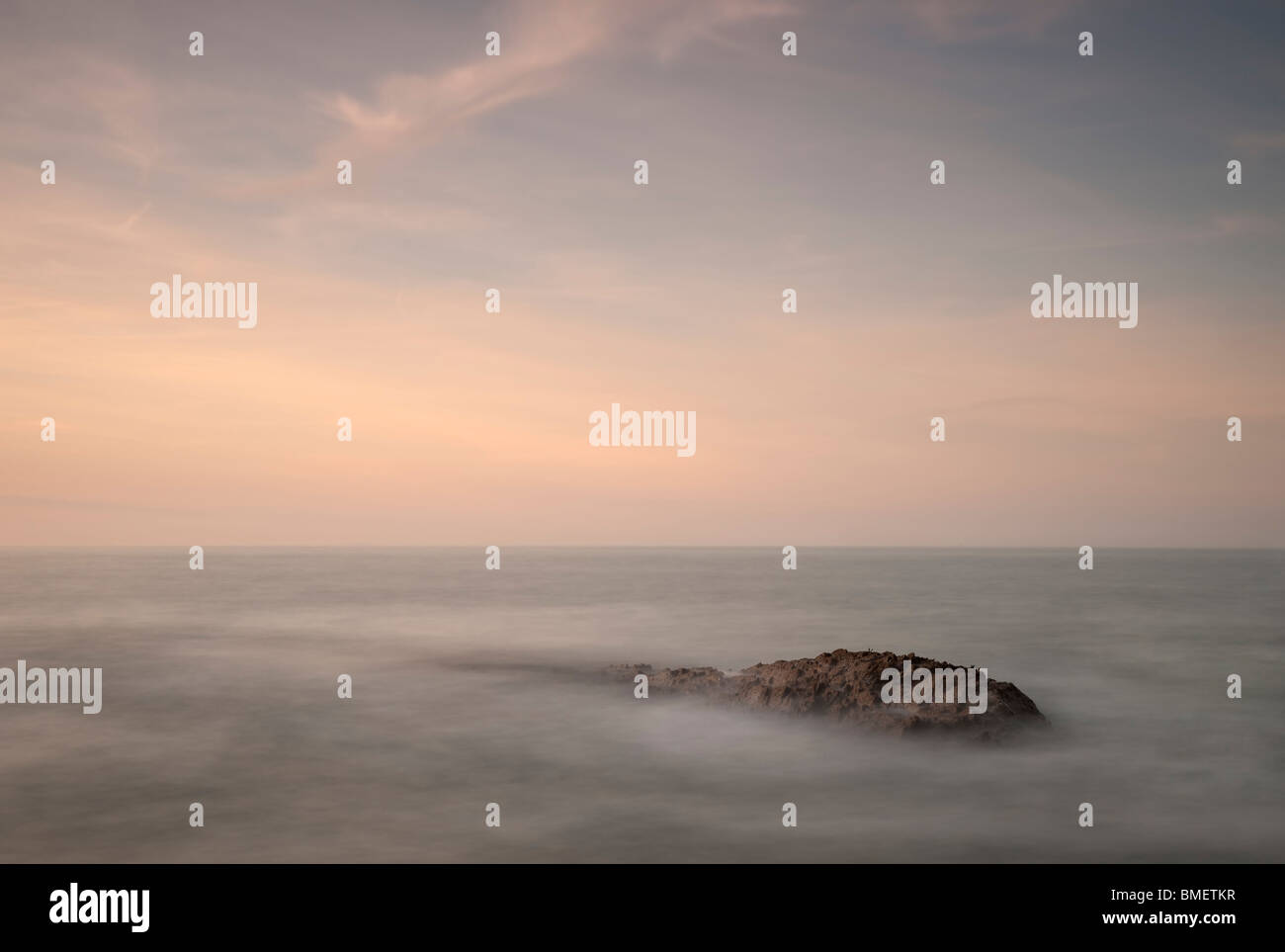 Single rock in the sea Stock Photo - Alamy