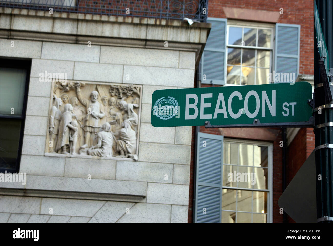 street sign in boston of beacon street with historic buildings in the ...