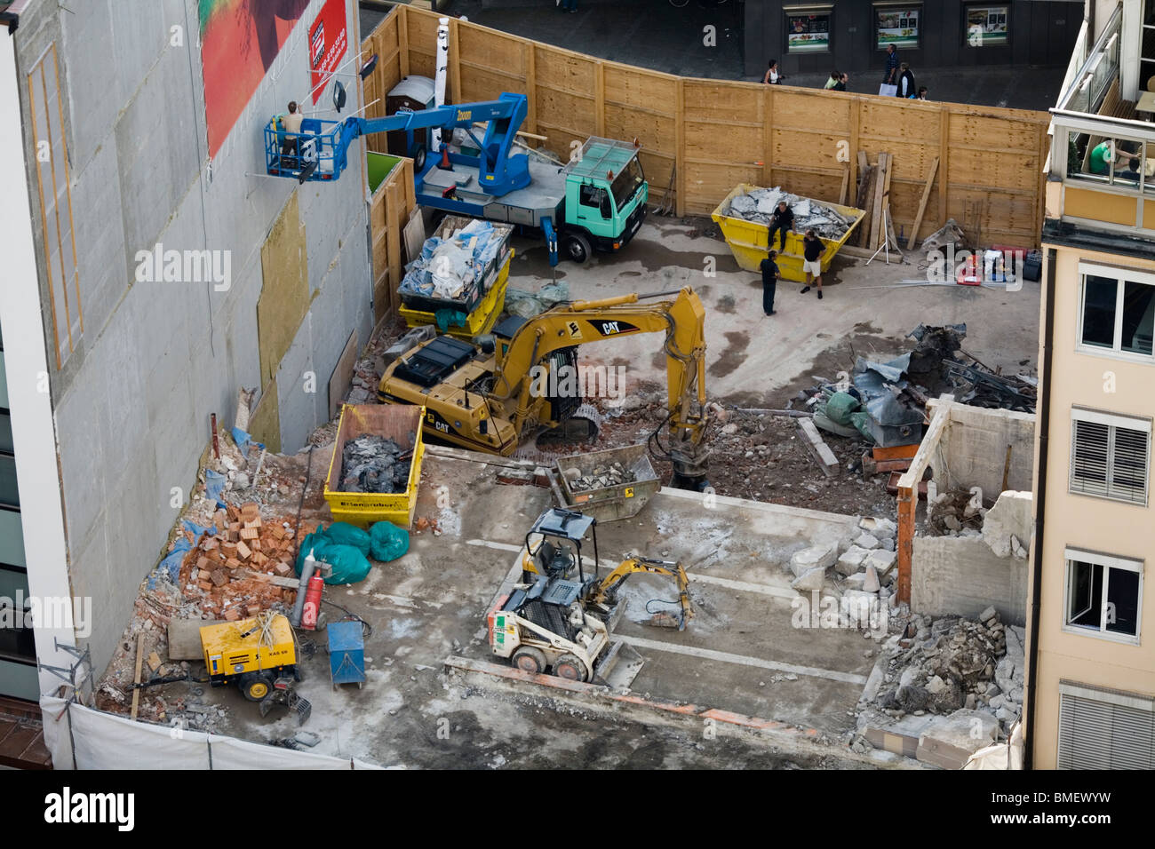 View of a demolition site and beginning of a new building with ...