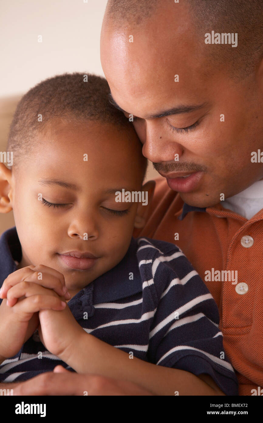 A Father And Son Praying Together Stock Photo - Alamy