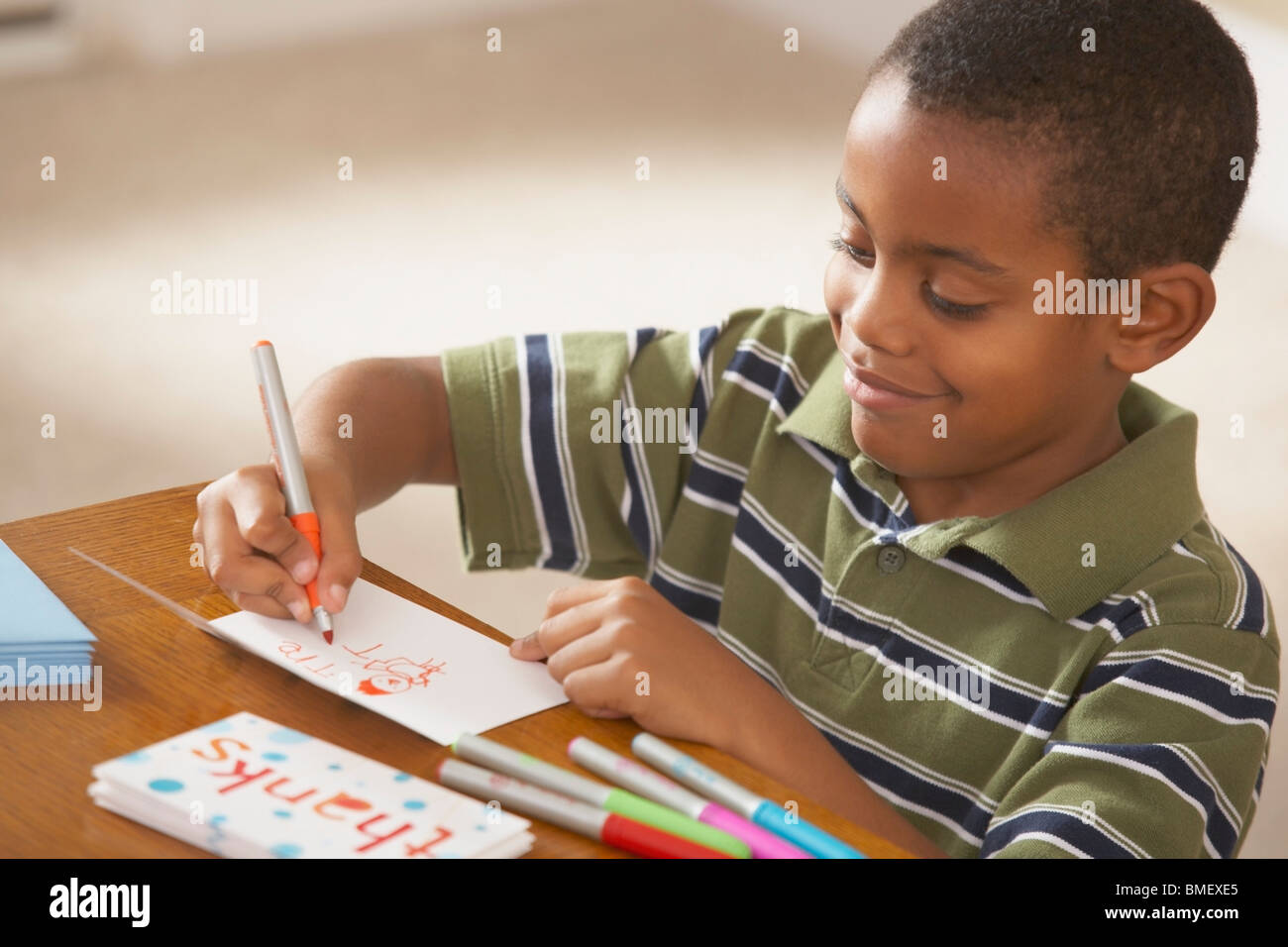A Boy Writing Thank You Cards Stock Photo - Alamy