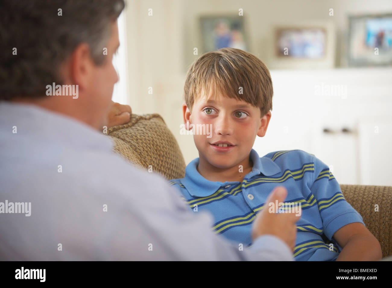 A Father And Son Talking Together Stock Photo - Alamy