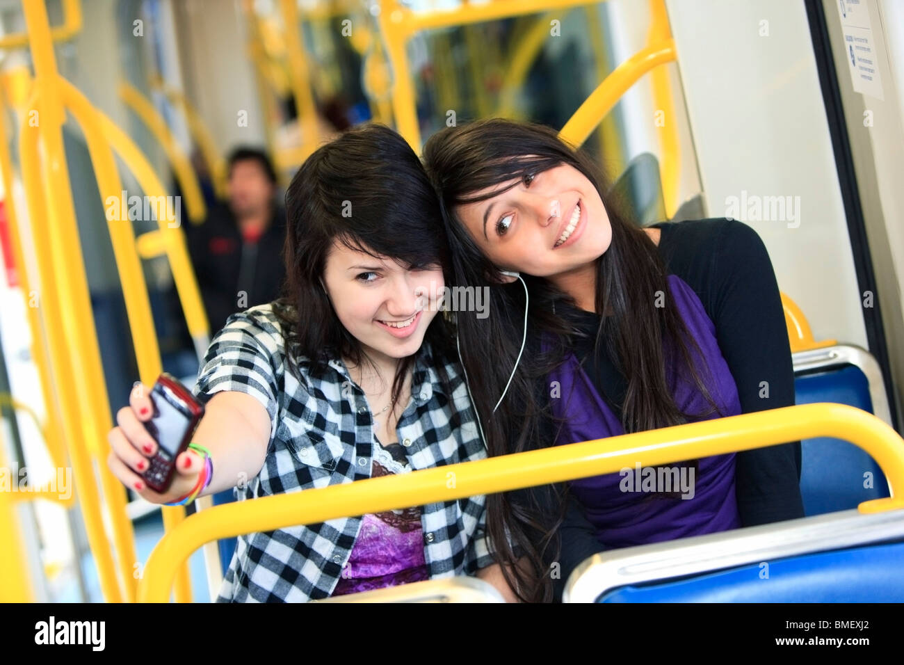 Portland, Oregon, United States Of America; Two Teenage Girls Listening ...
