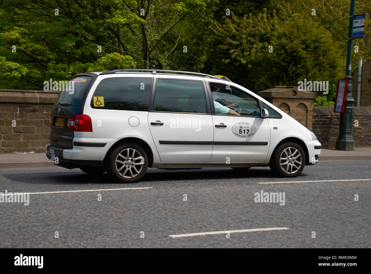 Taxi on the road in Huddersfield Stock Photo - Alamy