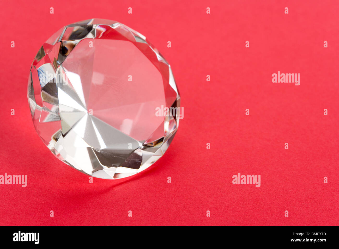 Diamond close up shot with red background Stock Photo - Alamy