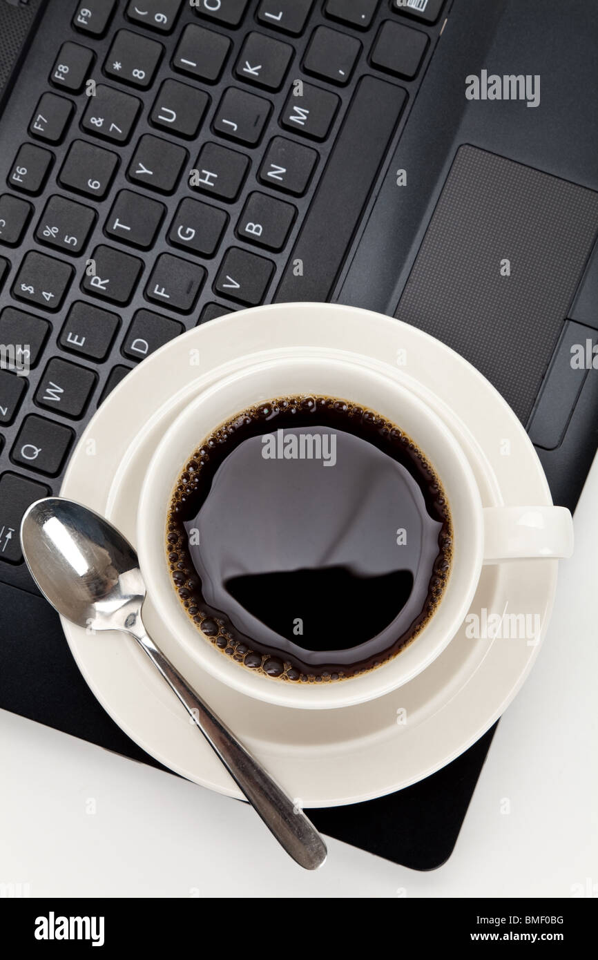 Coffee cup and computer close up Stock Photo - Alamy
