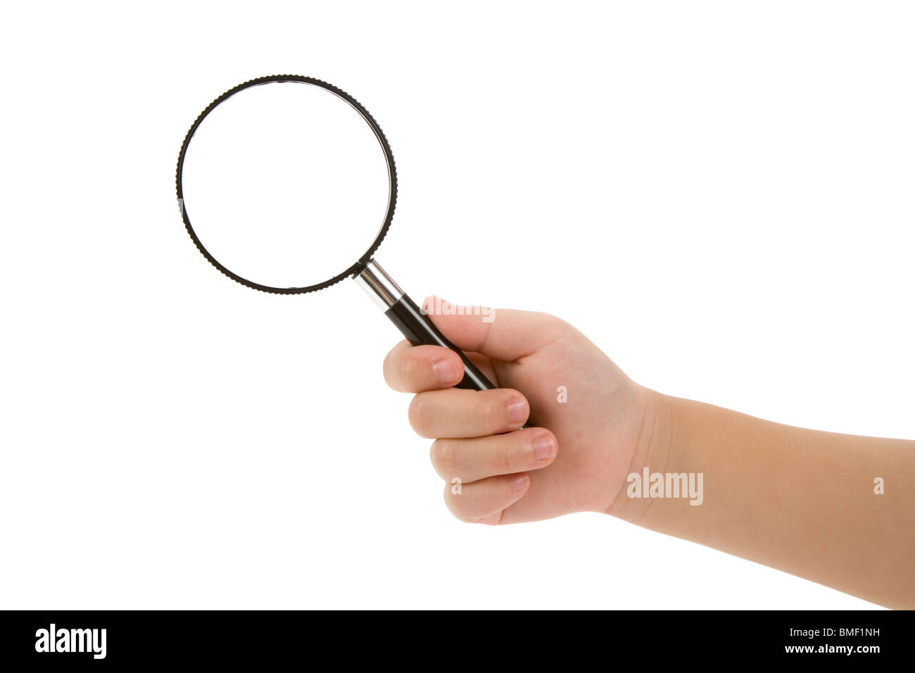 child's hand holding a magnifier Stock Photo - Alamy