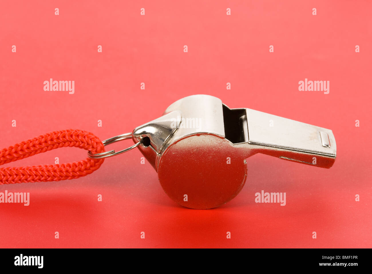 a whistle with red background Stock Photo - Alamy