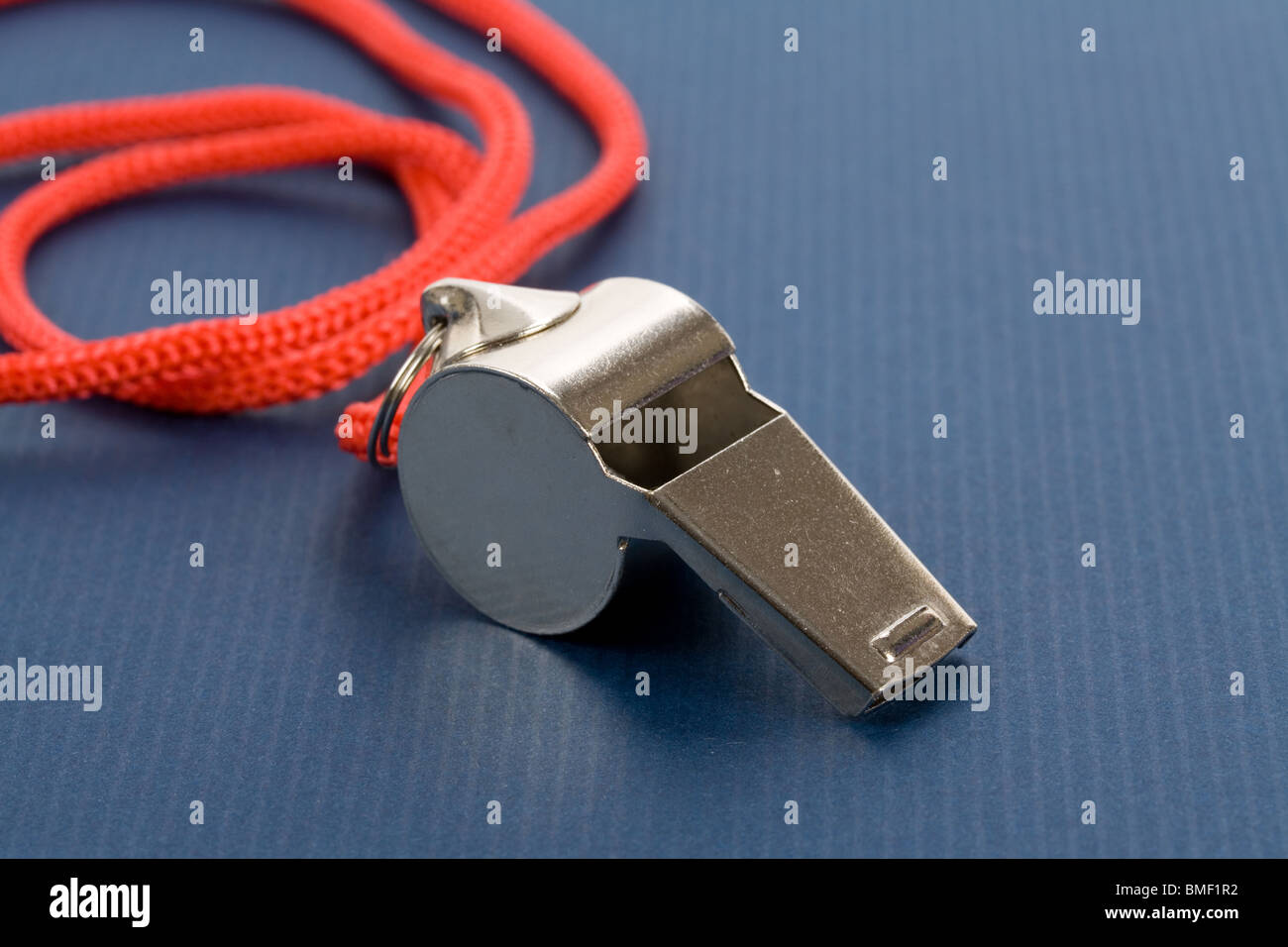 a whistle with blue background Stock Photo - Alamy