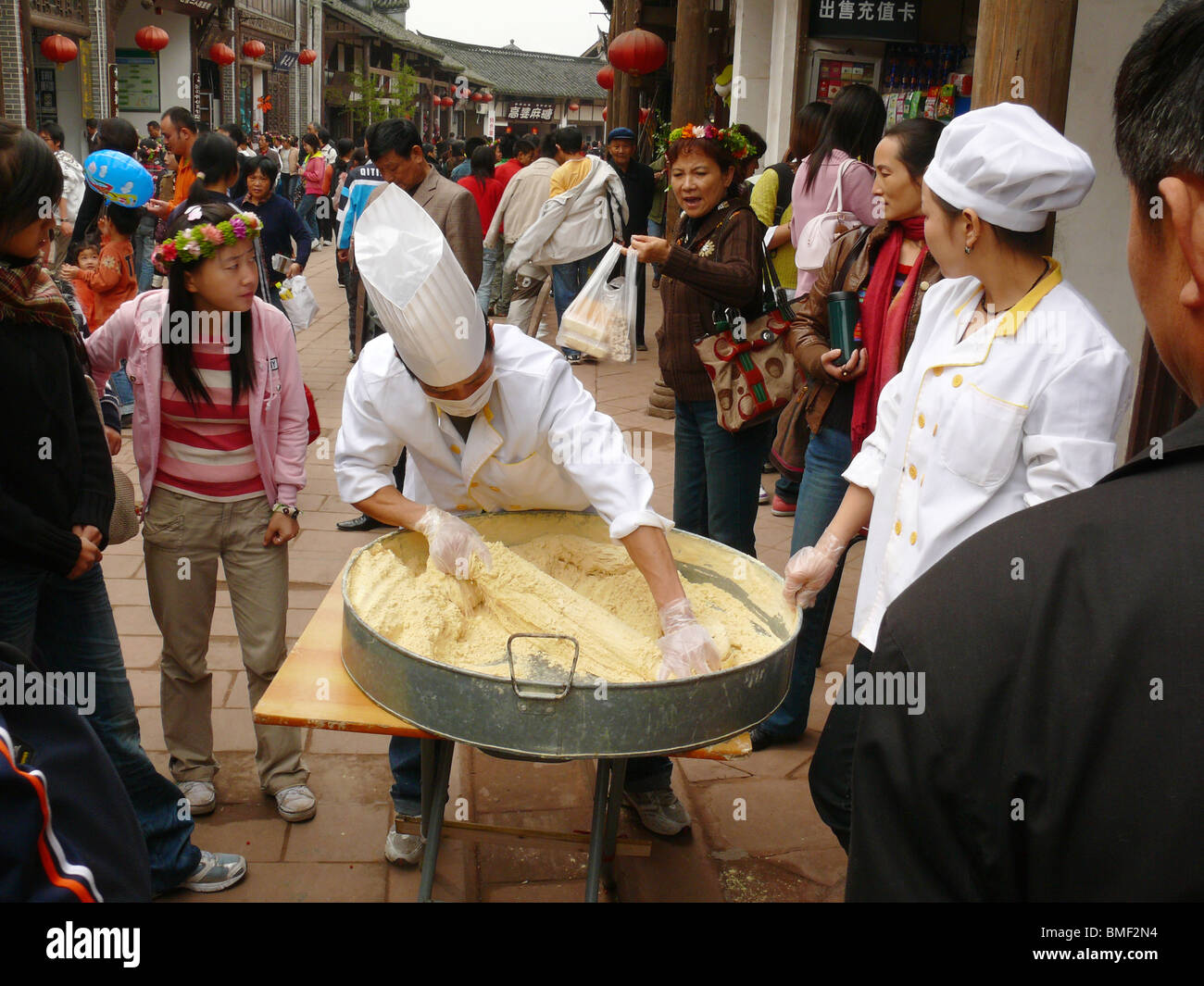 People making candy in Luodai Ancient Town, Chengdu, Sichuan Province ...