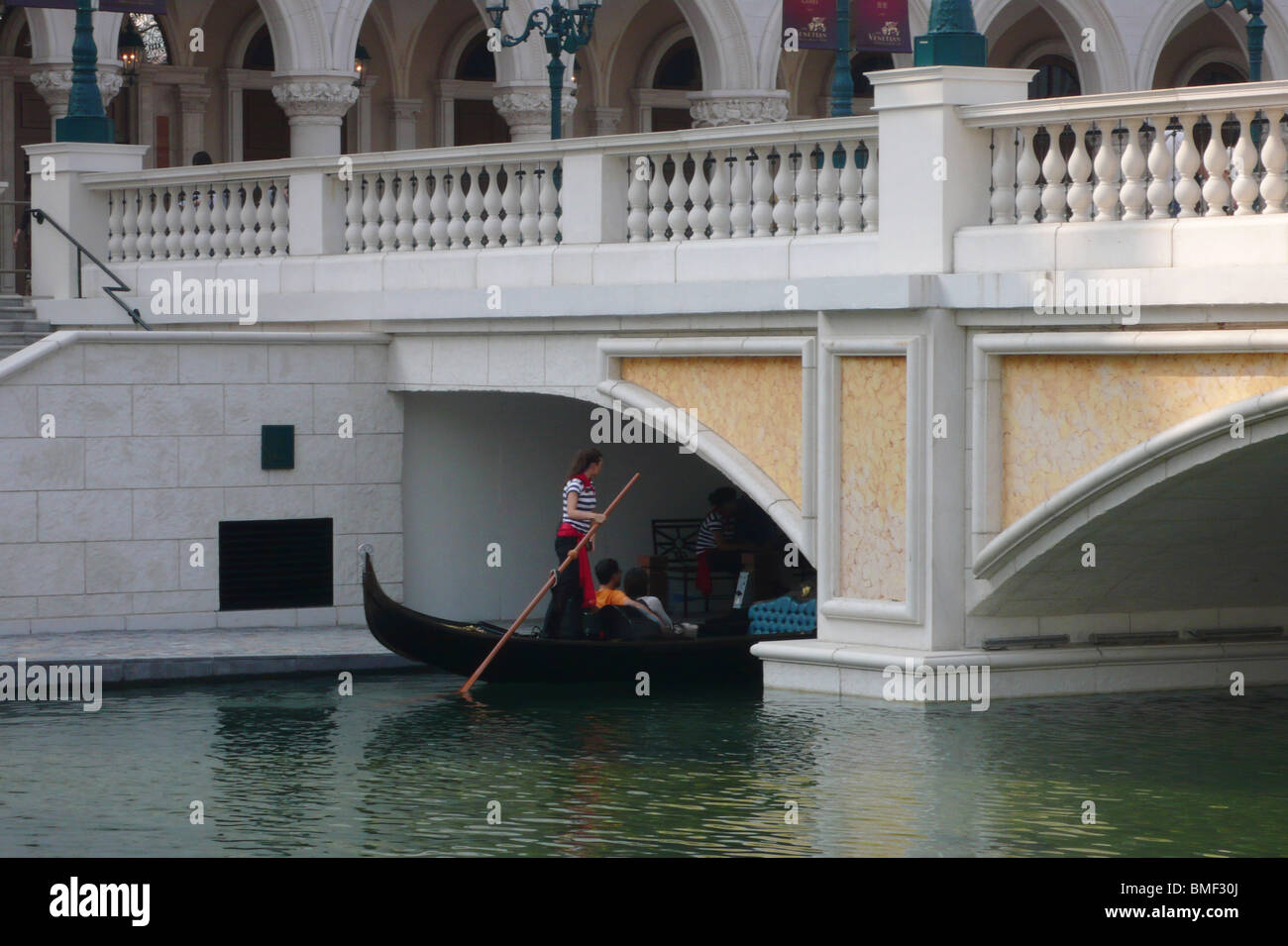 Guests taking gondola ride on Grand Canal, Venetian Macao-Resort-Hotel ...