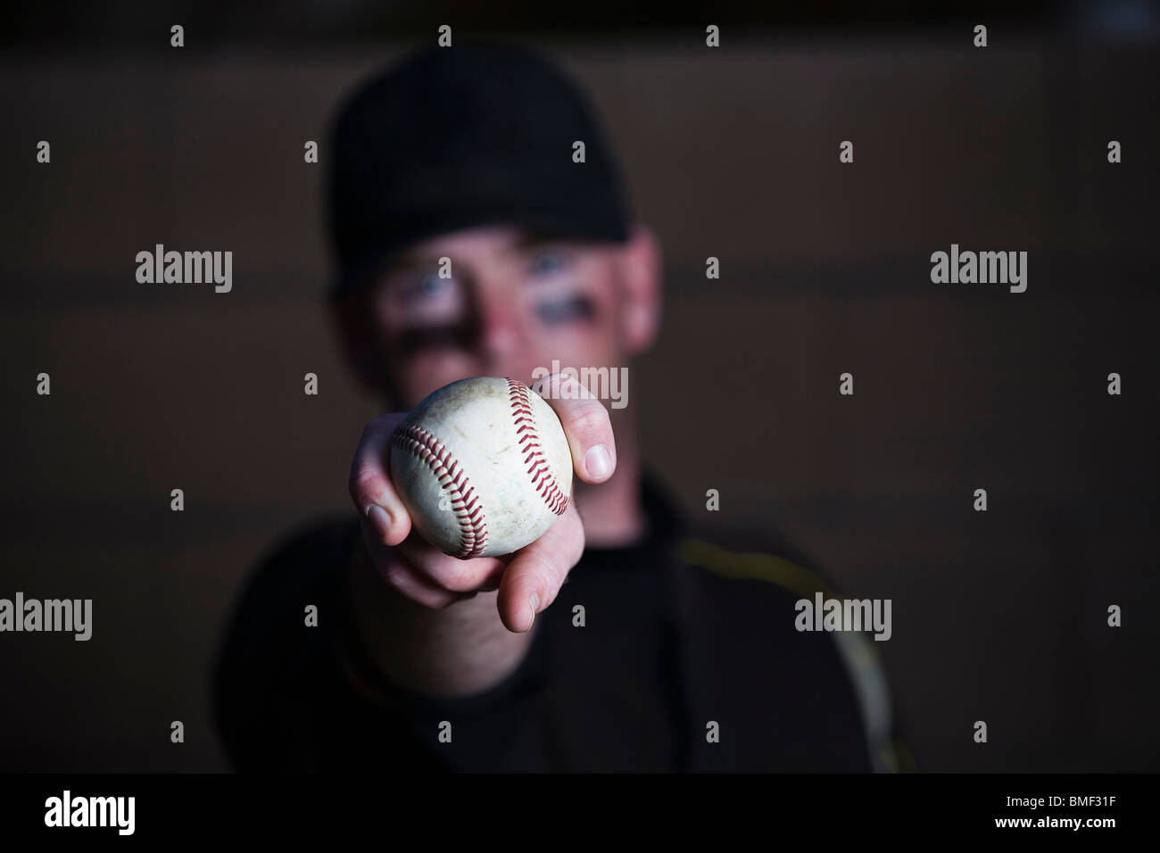 Baseball player holding the ball in a split finger grip Stock Photo - Alamy
