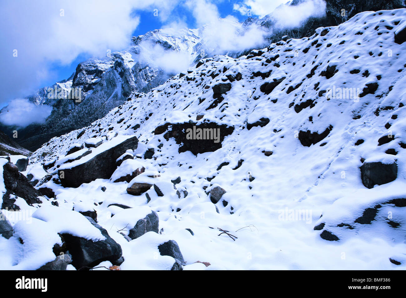 Snow covered rocky peaks in Hailuogou National Glacier Forest Park ...
