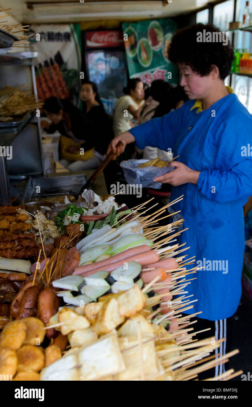 Woman cooking in a restaurant, Lanzhou, Gansu Province, China Stock ...