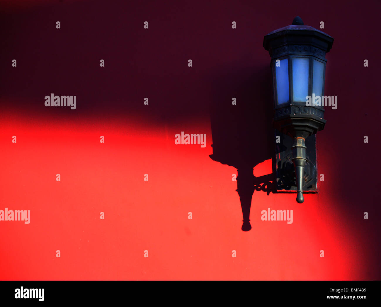Western style street light hanging on red palace wall, Forbidden City ...