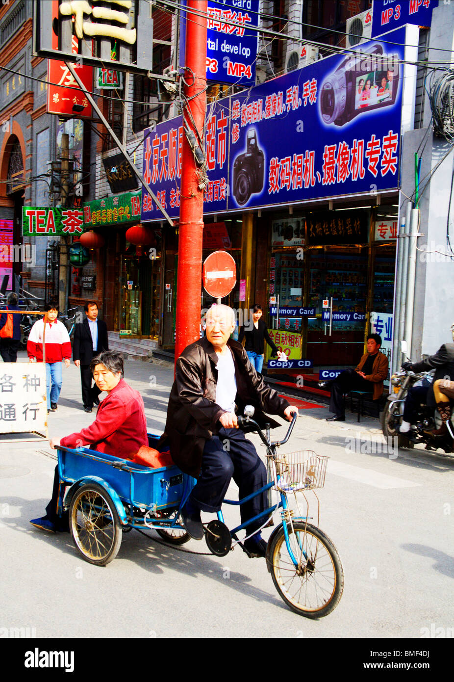 Elderly man riding tricycle with his wife, Dashila, Qianmen Street ...