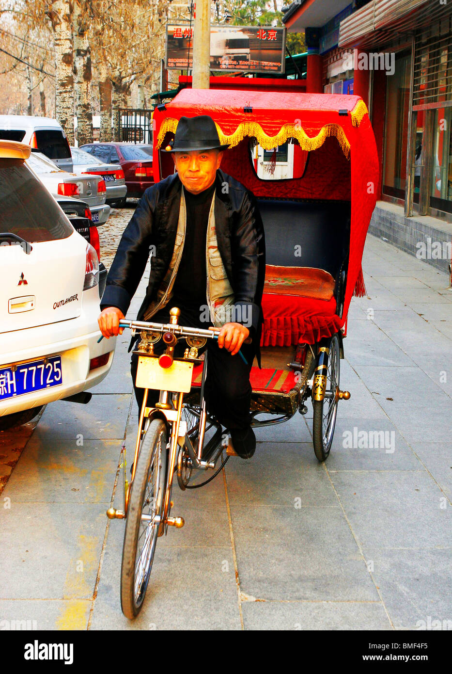 Man riding rickshaw, Beijing, China Stock Photo - Alamy