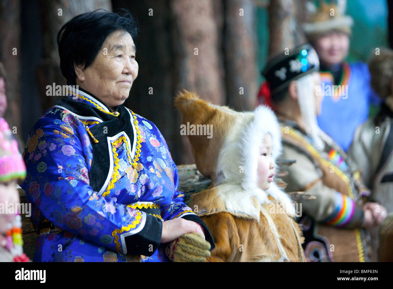 Elderly Oroqen woman with her grandson, Oroqin Autonomous Banner ...
