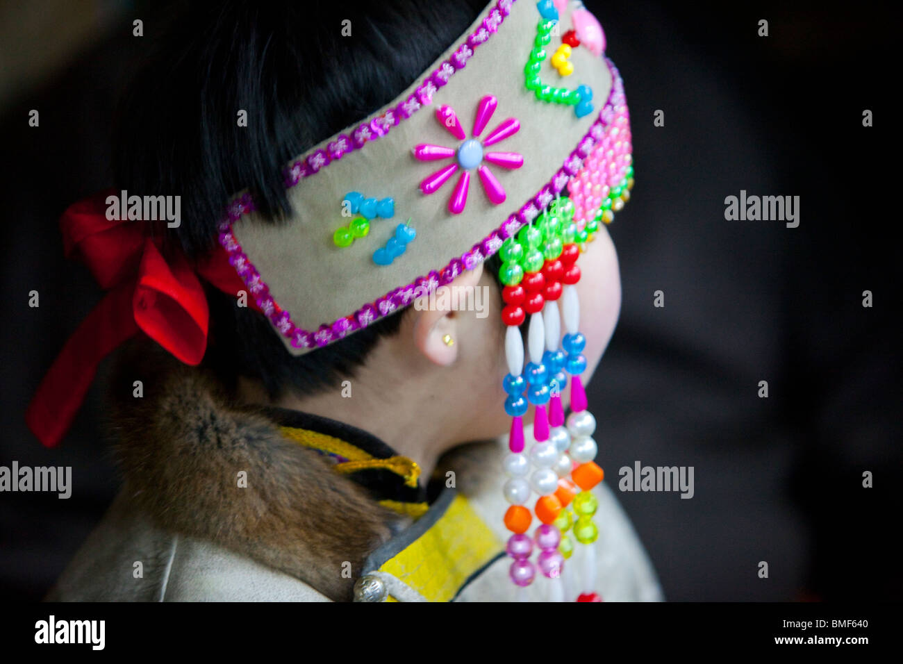 Oroqen girl wearing colorful headdress, Oroqin Autonomous Banner ...