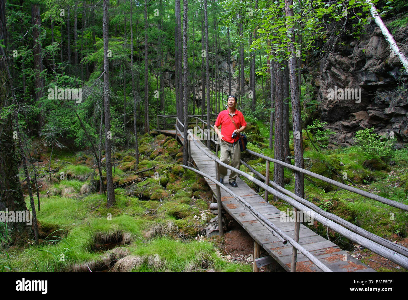 Man walking on the narrow path, Mudanjiang River, Mudanjiang ...