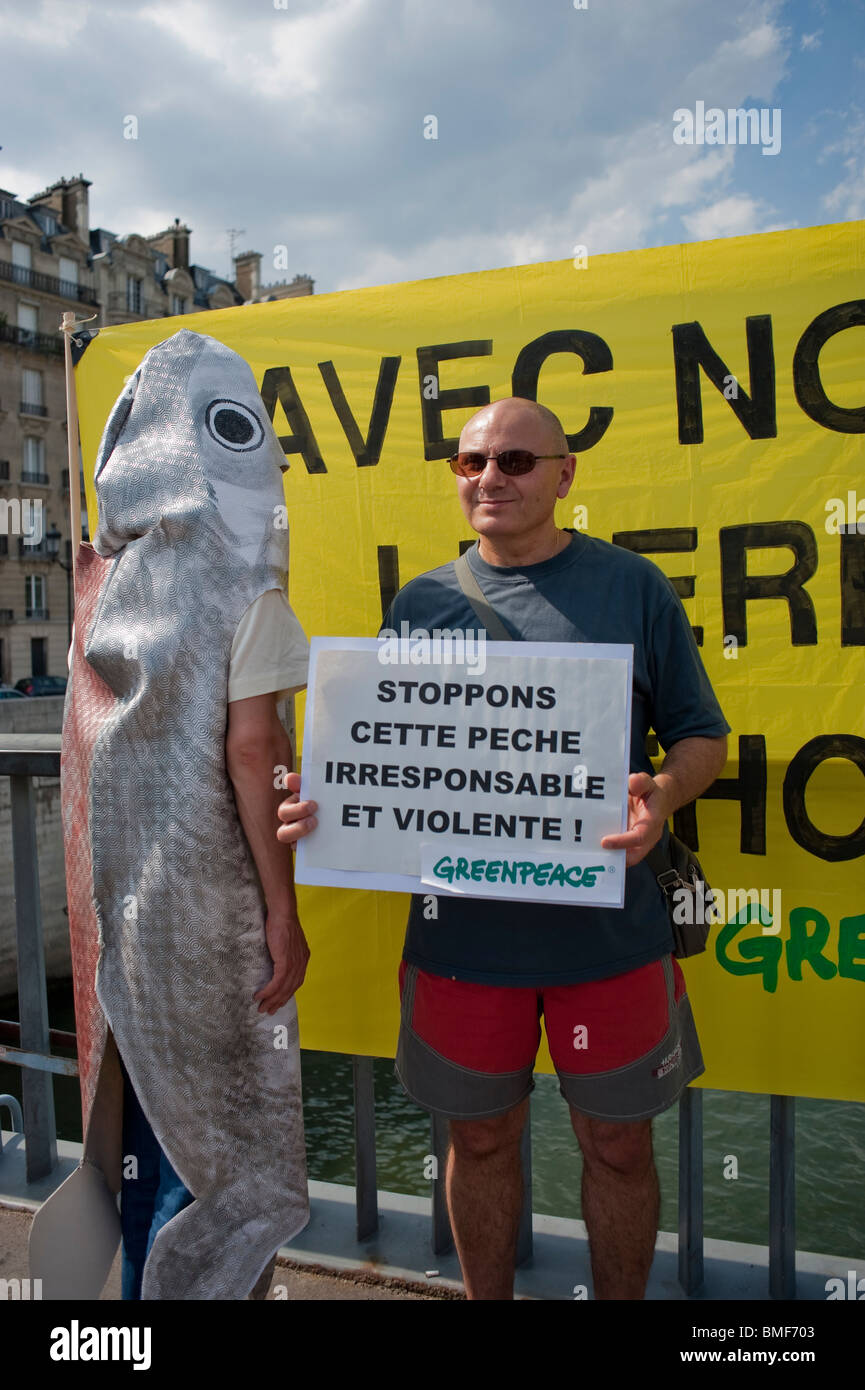 Man Holding Sign, with Environmental Activists from Greenpeace ...