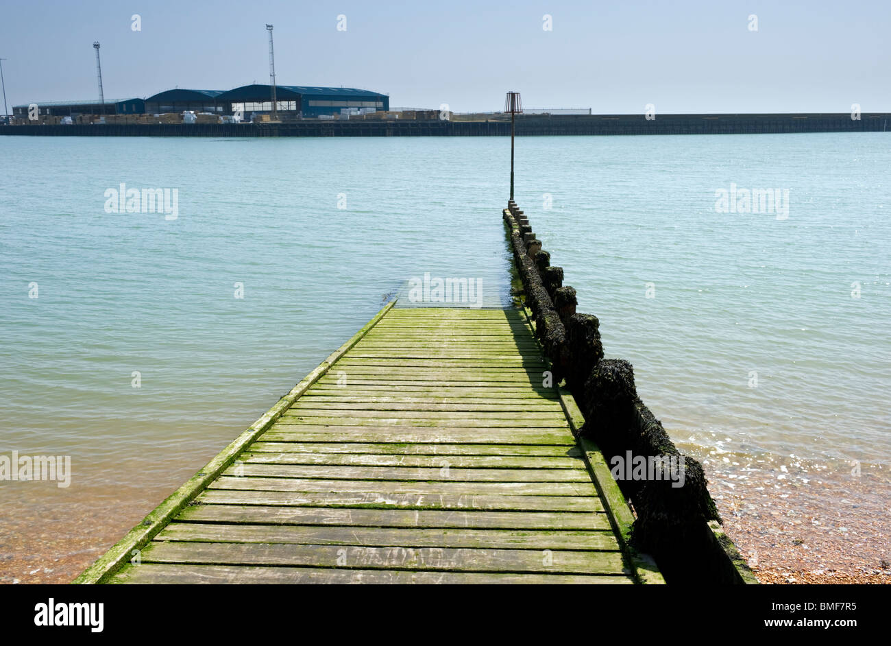 A wooden slipway, a sloping ramp for launching boats into the sea at ...